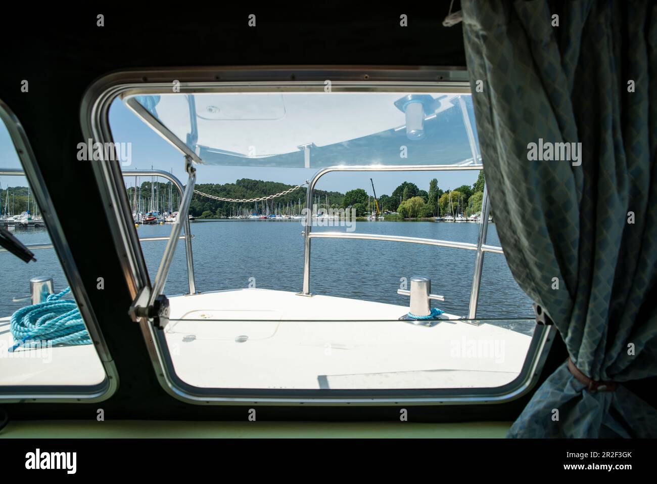 View through front houseboat window onto the Vilaine river, Port ...