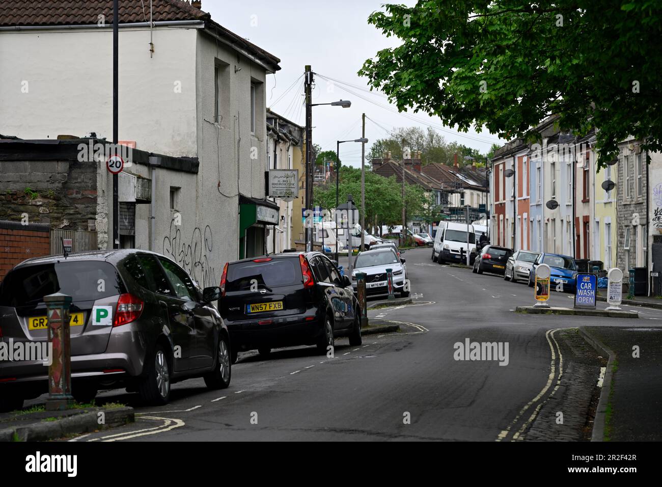 Residential street in Easton, Bristol, with house and cars parked along ...
