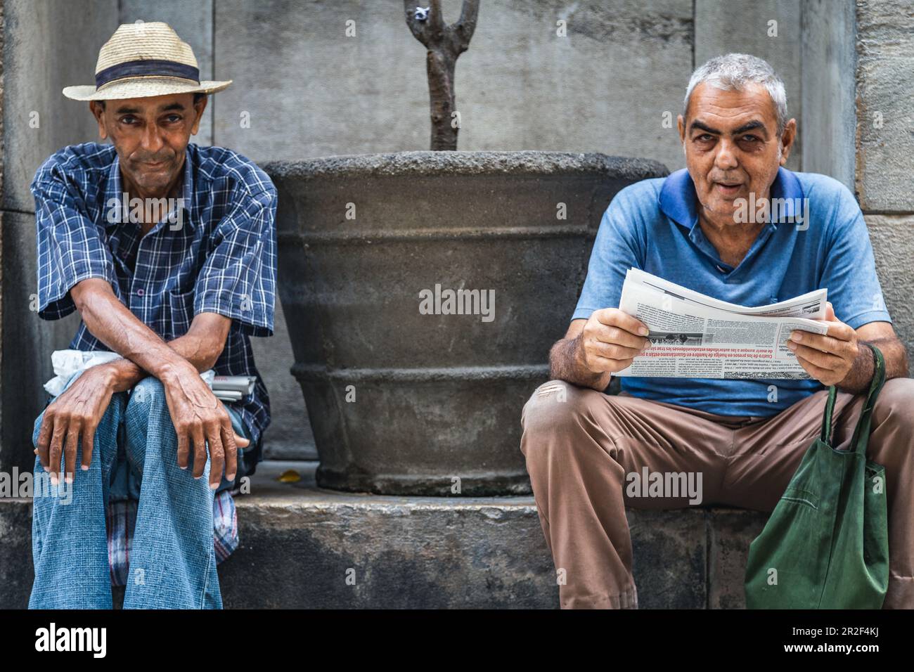 Two men sit side hi-res stock photography and images - Alamy