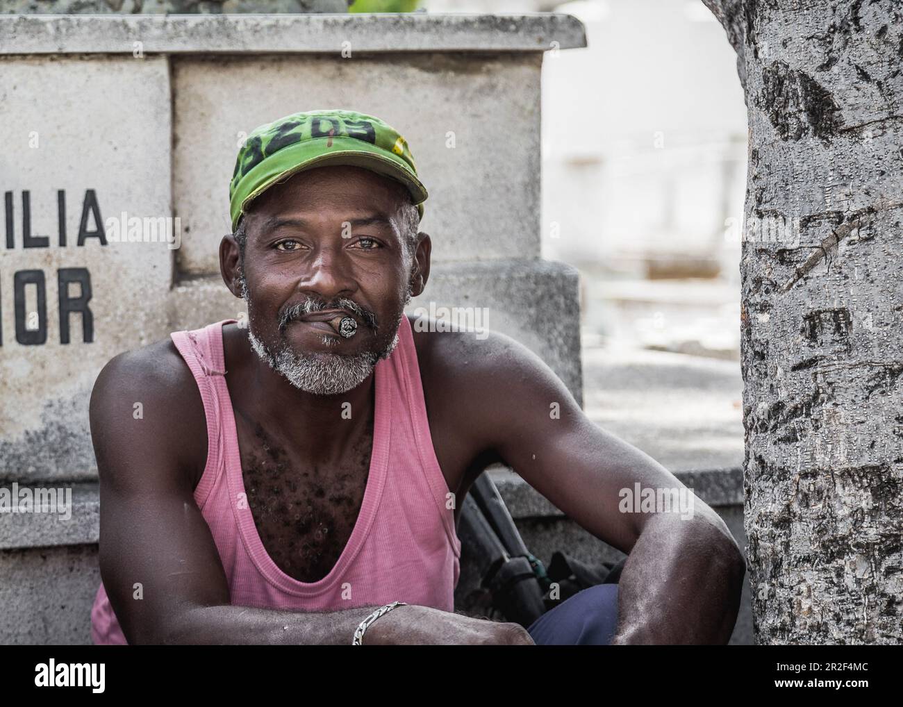 Cuban guy smoking his cigar to the last tobacco leaf, in Santiago de ...