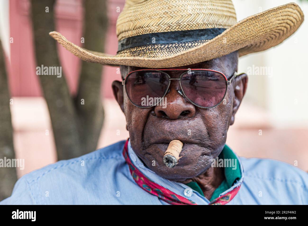 Dark skinned man with straw hat hi-res stock photography and images - Alamy