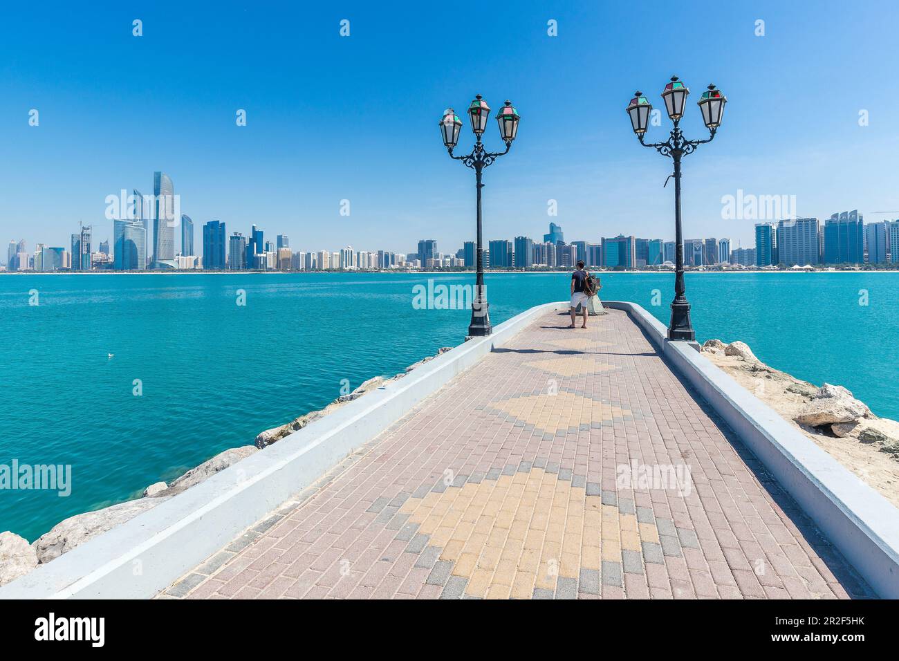 Tourist on Breakwater Beach in Abu Dhabi, UAE Stock Photo - Alamy