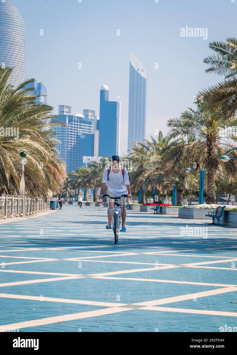 Cycling the Abu Dhabi Corniche, UAE Stock Photo - Alamy