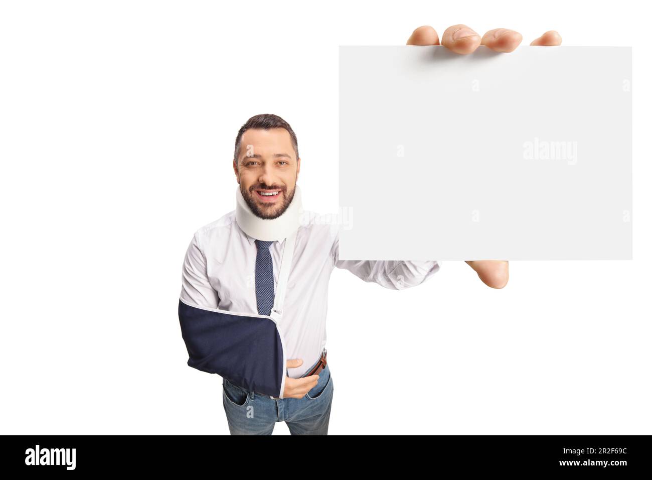 Young injured man with a cervical collar and arm sling showing a blank ...