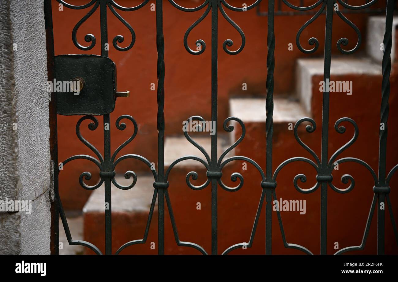 Antique handcrafted wrought iron entrance gate railing Stock Photo - Alamy