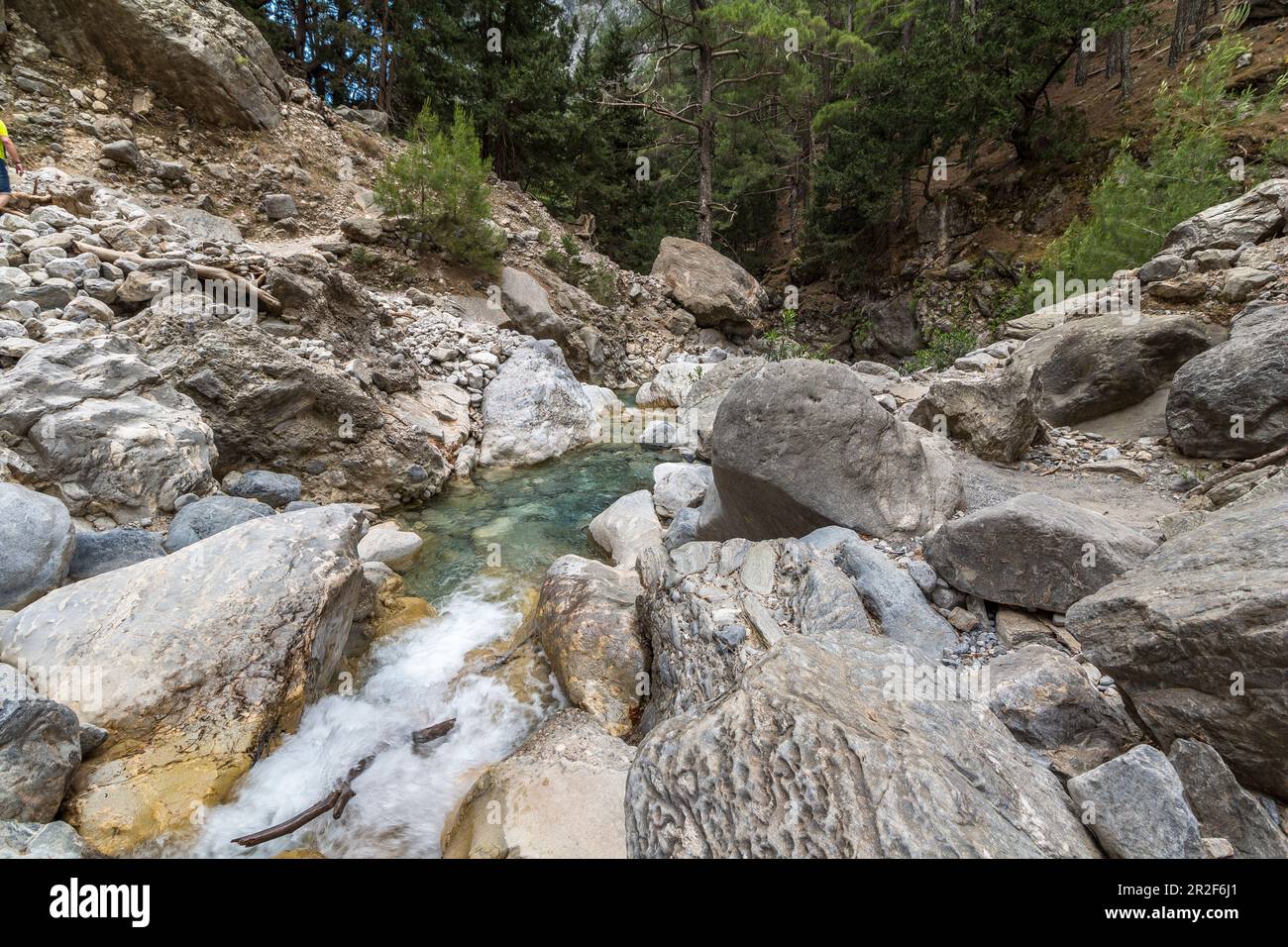 River course with turquoise clear water on the Samaria Gorge hike, West ...