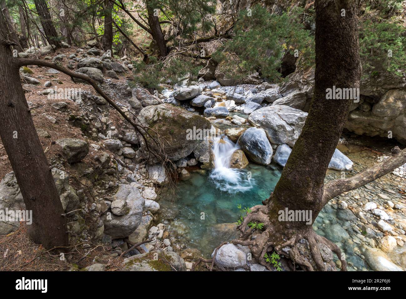 River course with turquoise clear water on the Samaria Gorge hike, West ...