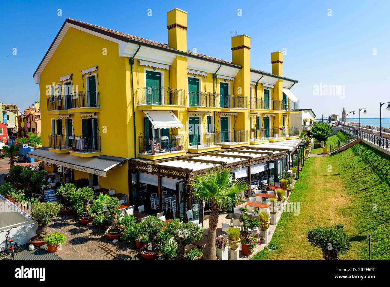 Colorful house facades in Caorle, Veneto, Italy Stock Photo - Alamy