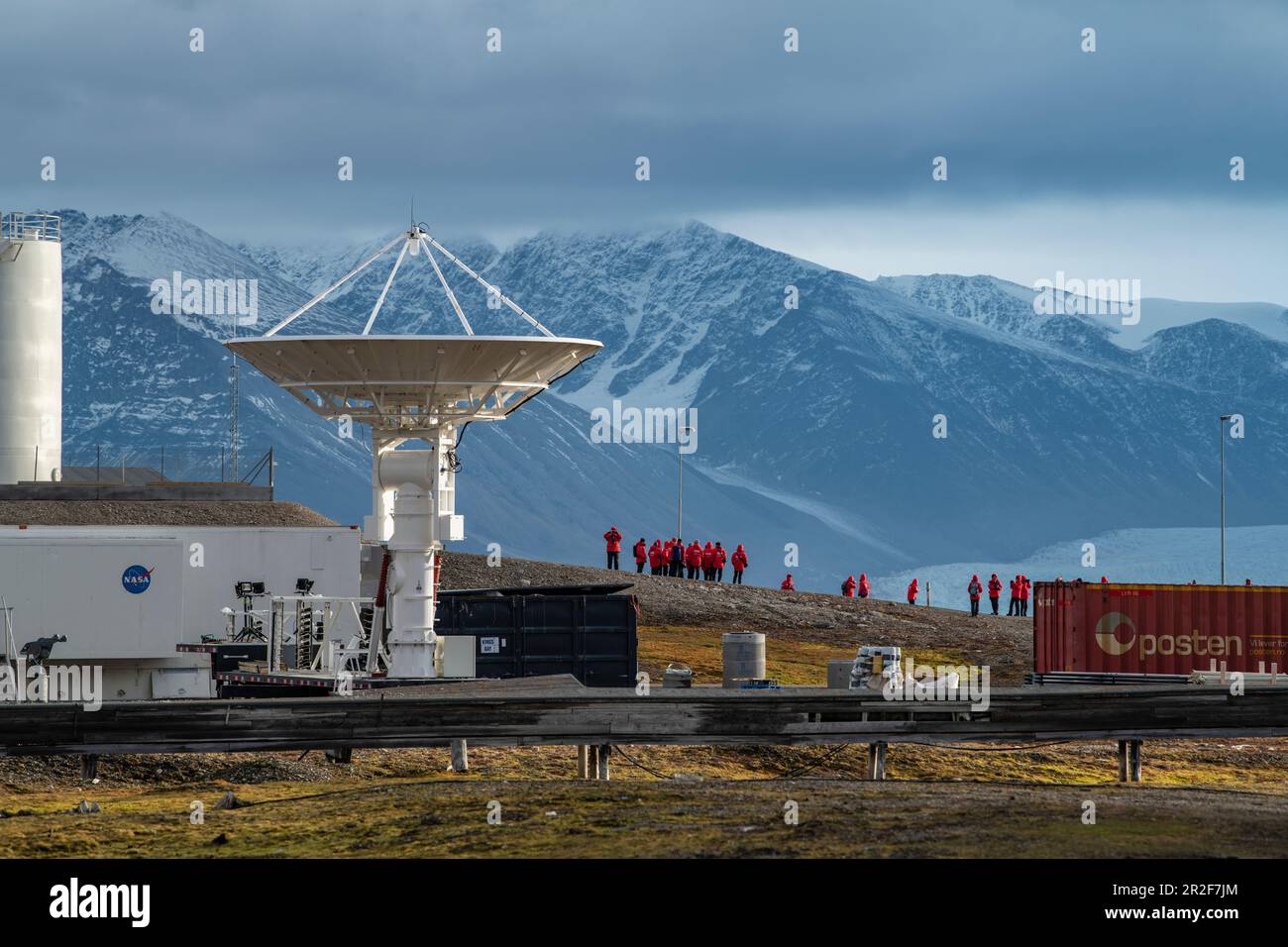 NASA's satellite antenna points to the sky as passengers of the ...