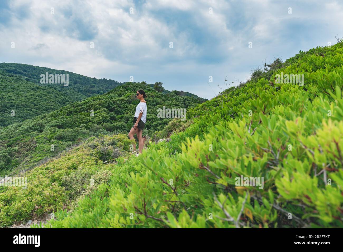 Tourist on the way to Kastro beach on Skiathos island, Greece Stock ...
