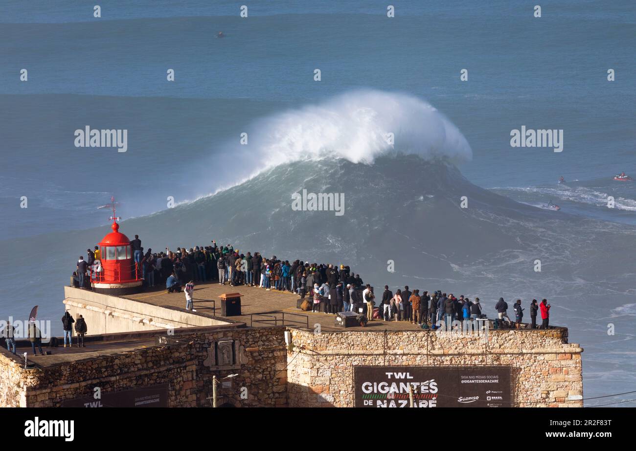 Europe, Portugal, Oeste Region, Nazaré, Crowd watching the Huge Waves ...