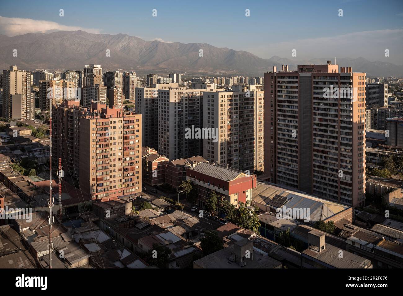 View of apartment blocks and surrounding mountains of the capital city ...