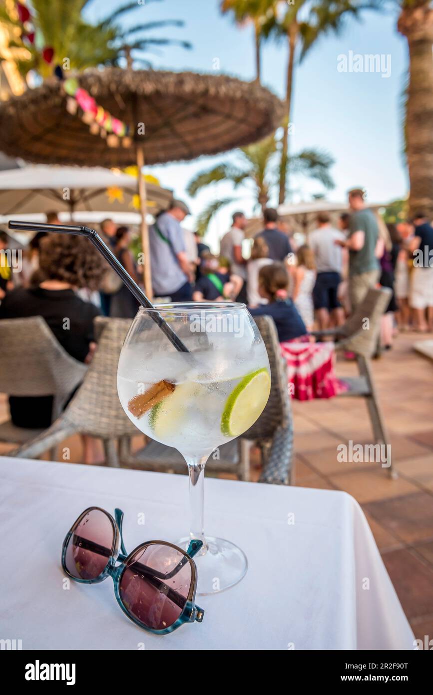 Summer evening drink on the hotel terrace, Cala Santanyi, Mallorca ...