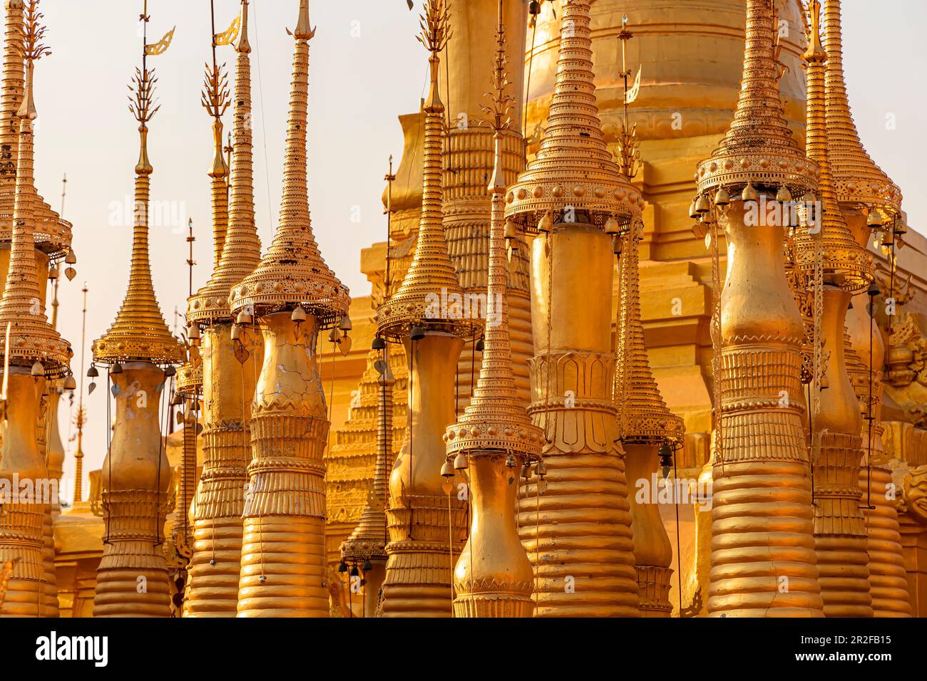 Shwe Inn Dein Pagoda - stupa field with golden stupas in the evening ...