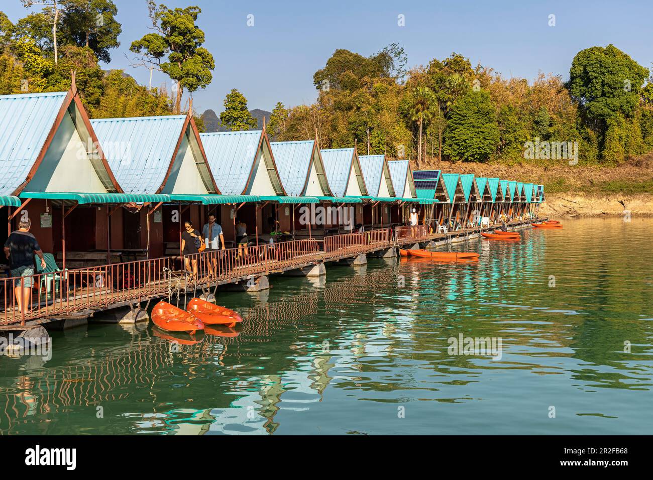 View over footbridge with bungalows (Khao Sok Smiley Lake House) on the ...