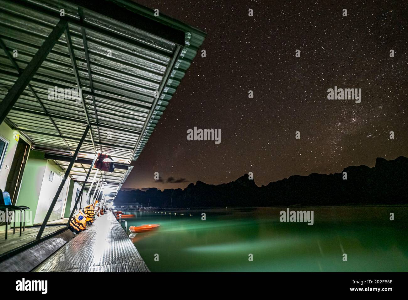View over footbridge with bungalows (Khao Sok Smiley Lake House) at ...