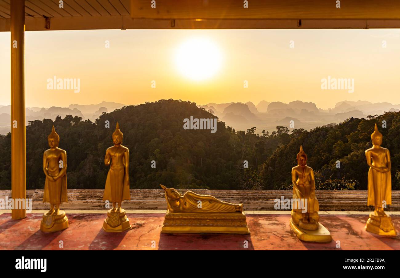 Buddha statues at sunset on Tiger Cave Mountain, Tiger Cave Temple ...