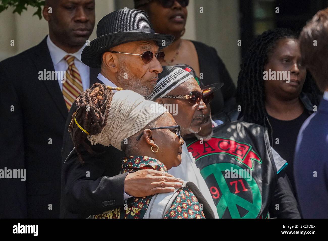 Andre Zachery, second from left, father of Jordan Neely stands outside ...
