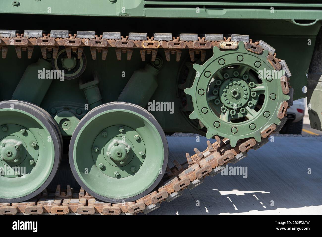 Green tank tracks parked on a concrete pad on display at the Military ...