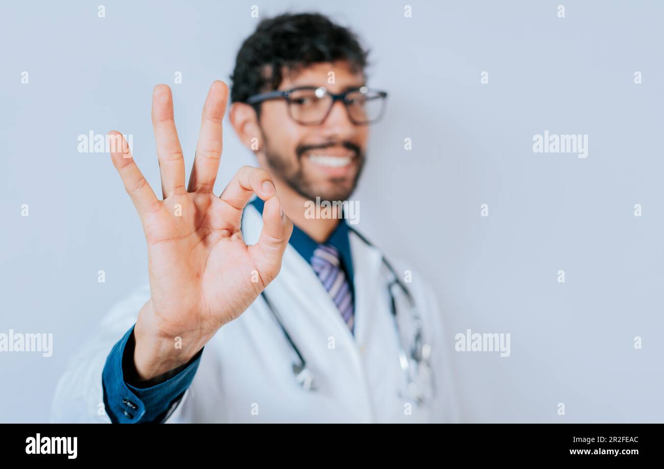 Happy doctor gesturing approval isolated. Handsome doctor approving and ...