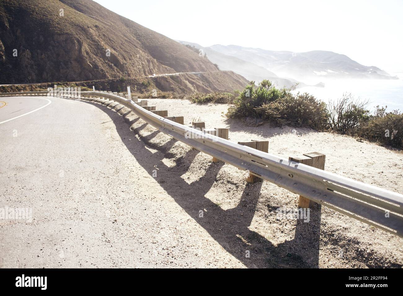 Guardrail on Highway 1 with a view of the Santa Lucia Range and the ...