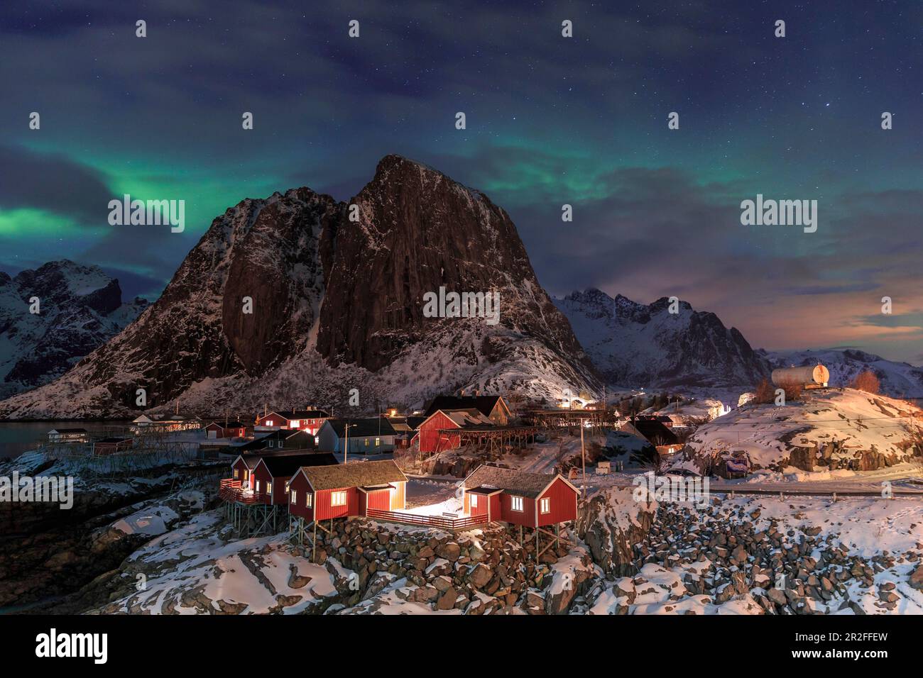 Northern Lights Or Aurora Borealis Over Red Rorbuer Fishermen s Cabins Northern Lights Or Aurora Borealis Over Red Rorbuer Fishermen s Cabins