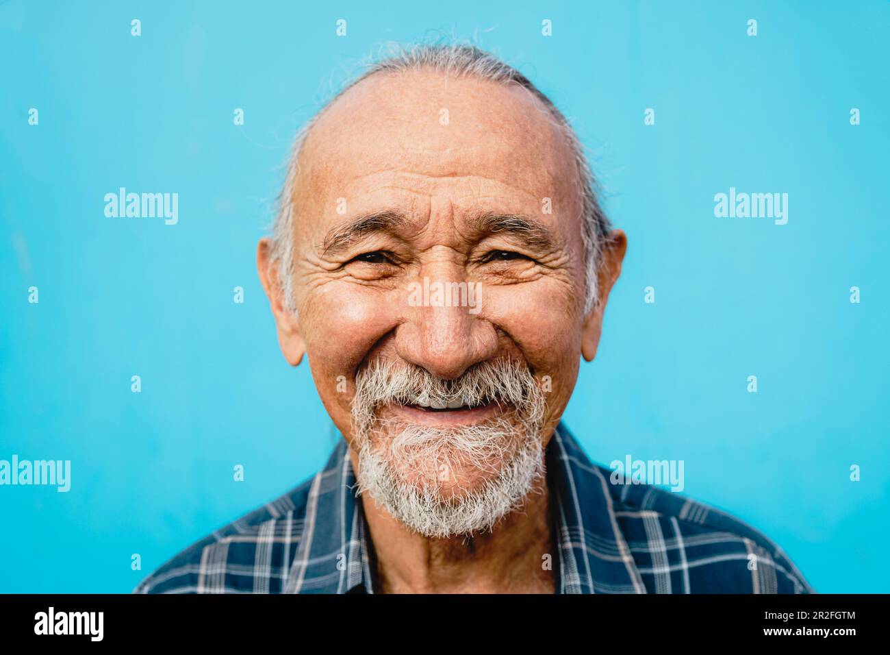 Happy senior man having fun looking and smiling into the camera ...