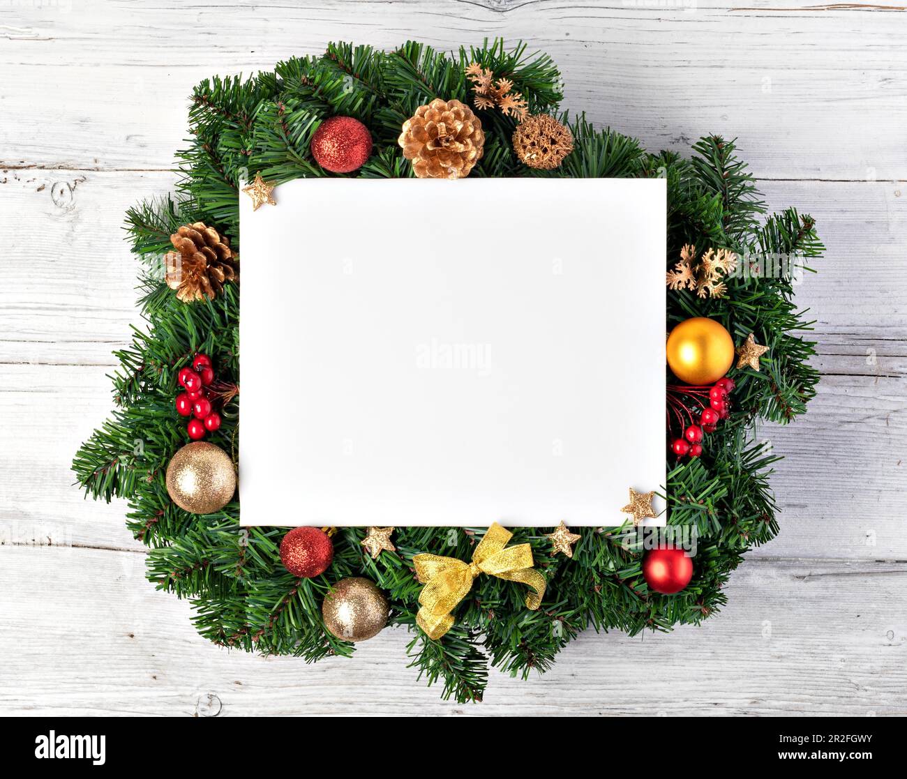 Christmas tree branches and ball with paper card note Stock Photo - Alamy