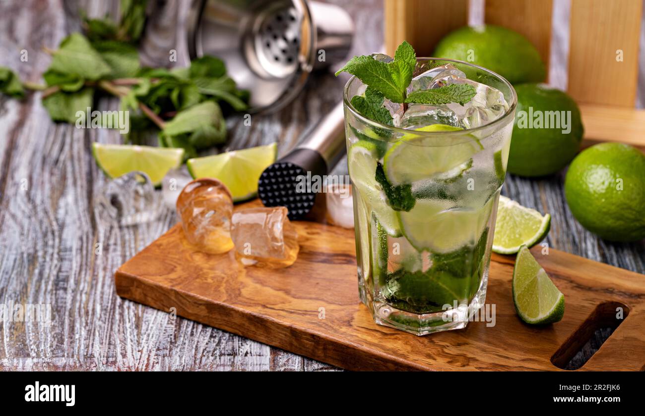 Fresh Mojito cocktail with lime, mint and ice Stock Photo - Alamy