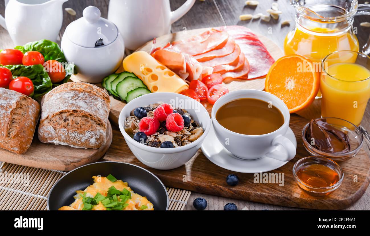 Breakfast served with coffee, orange juice, scrambled eggs, cereals ...