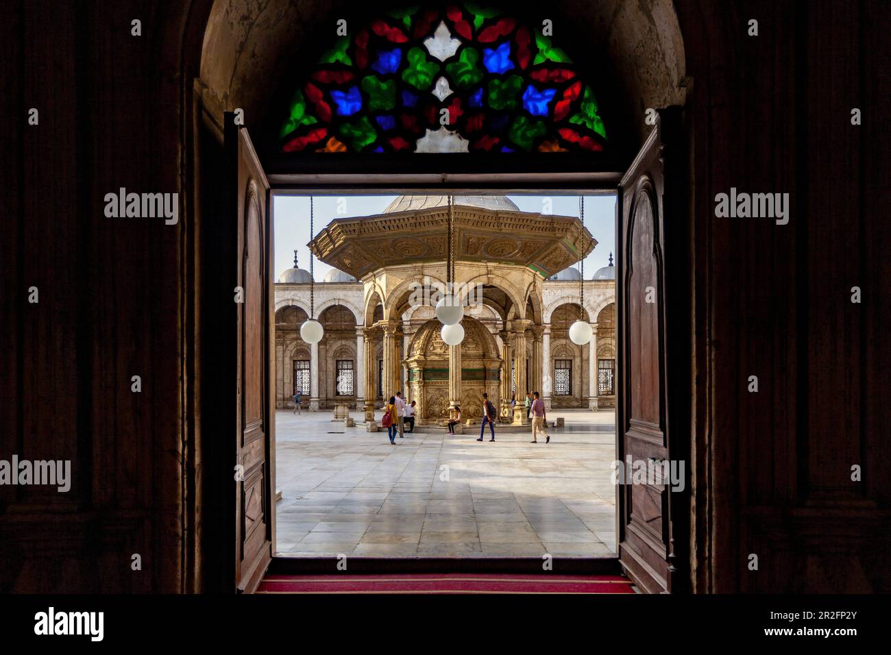 Doorway and stained glass window leading onto the courtyard of Great ...