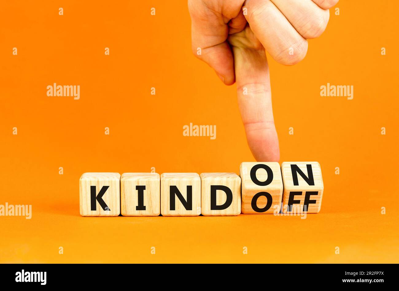Kind on or off symbol. Businessman turns wooden cubes and changes word ...