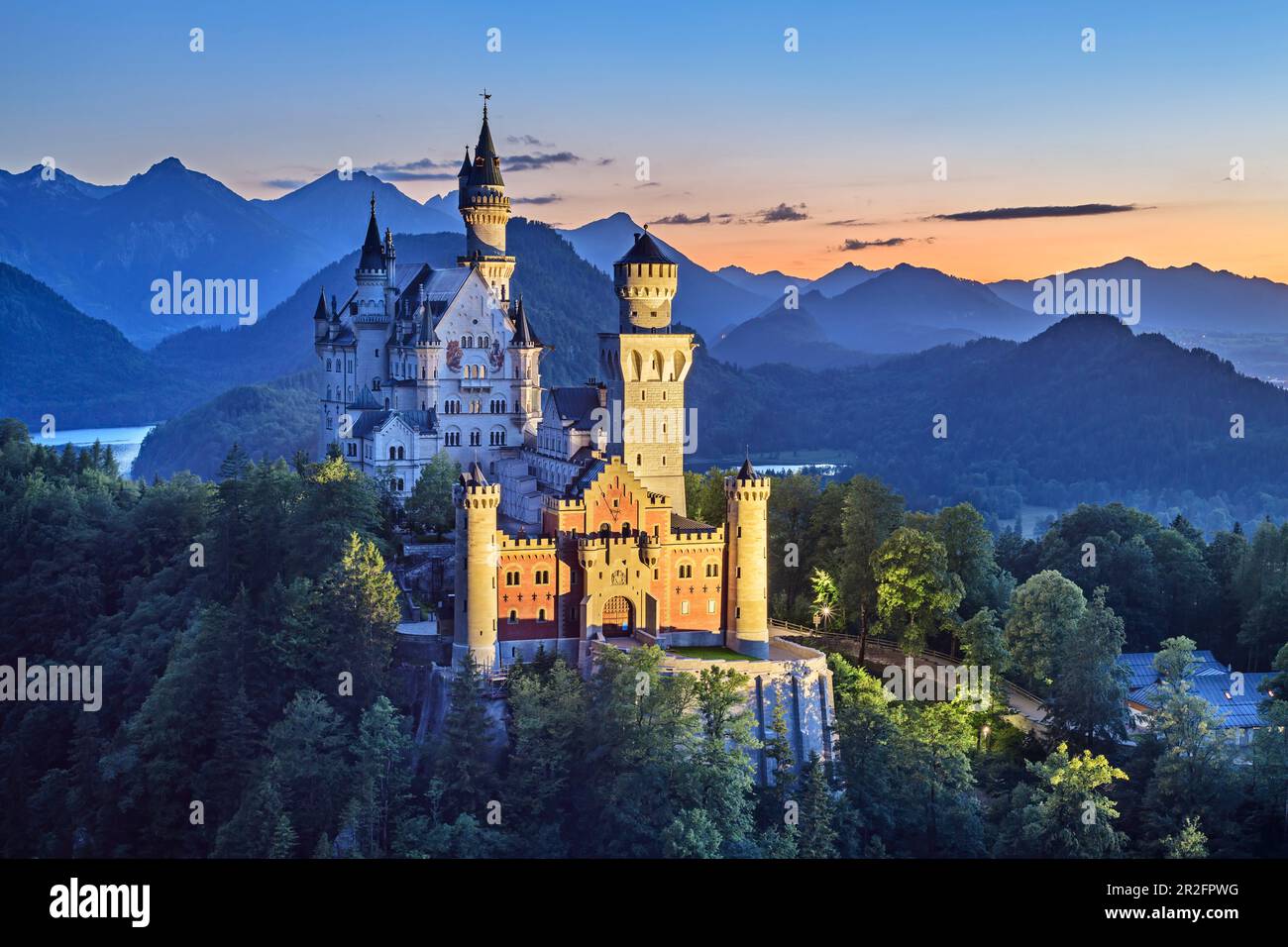 Neuschwanstein Castle, illuminated, in front of Tannheimer Bergen ...