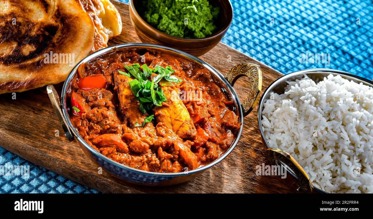 Butter chicken with rice and naan flatbread served in original indian ...