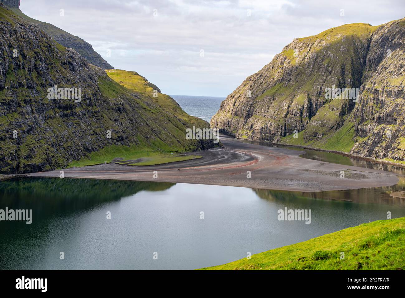 Lagoon with red algae at low tide in one of the most beautiful places ...