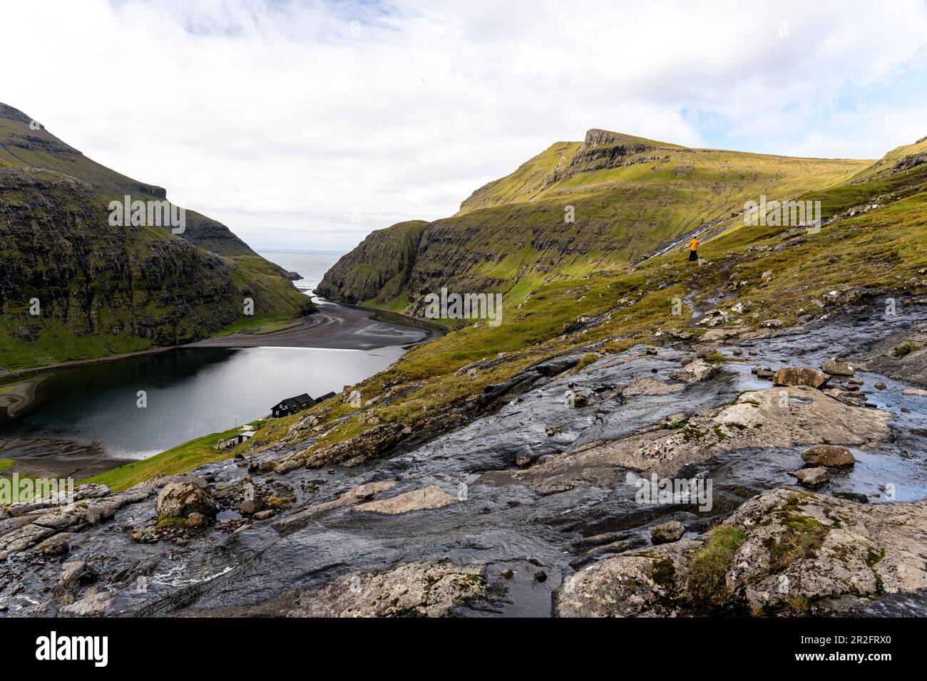View of the valley with the lagoon at Saksun, from a hiking trail, to ...