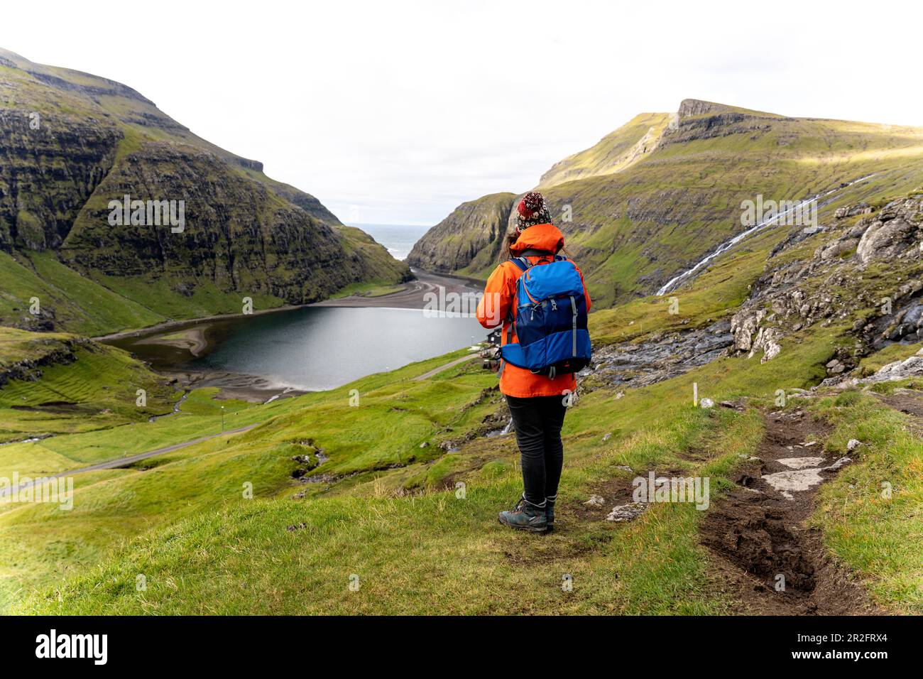 View of the valley with the lagoon at Saksun, from a hiking trail, to ...