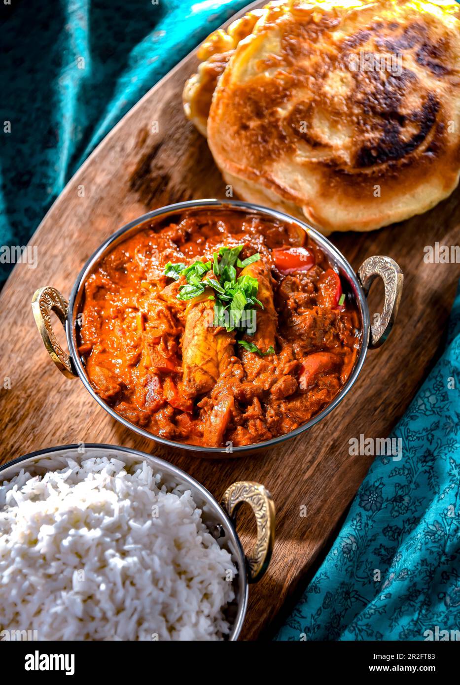Butter chicken with rice and naan flatbread served in original indian ...