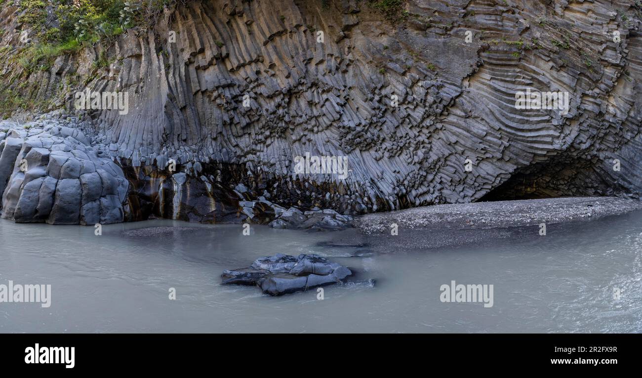 Rock formations of basalt and lava rock in the river park Gole dell ...