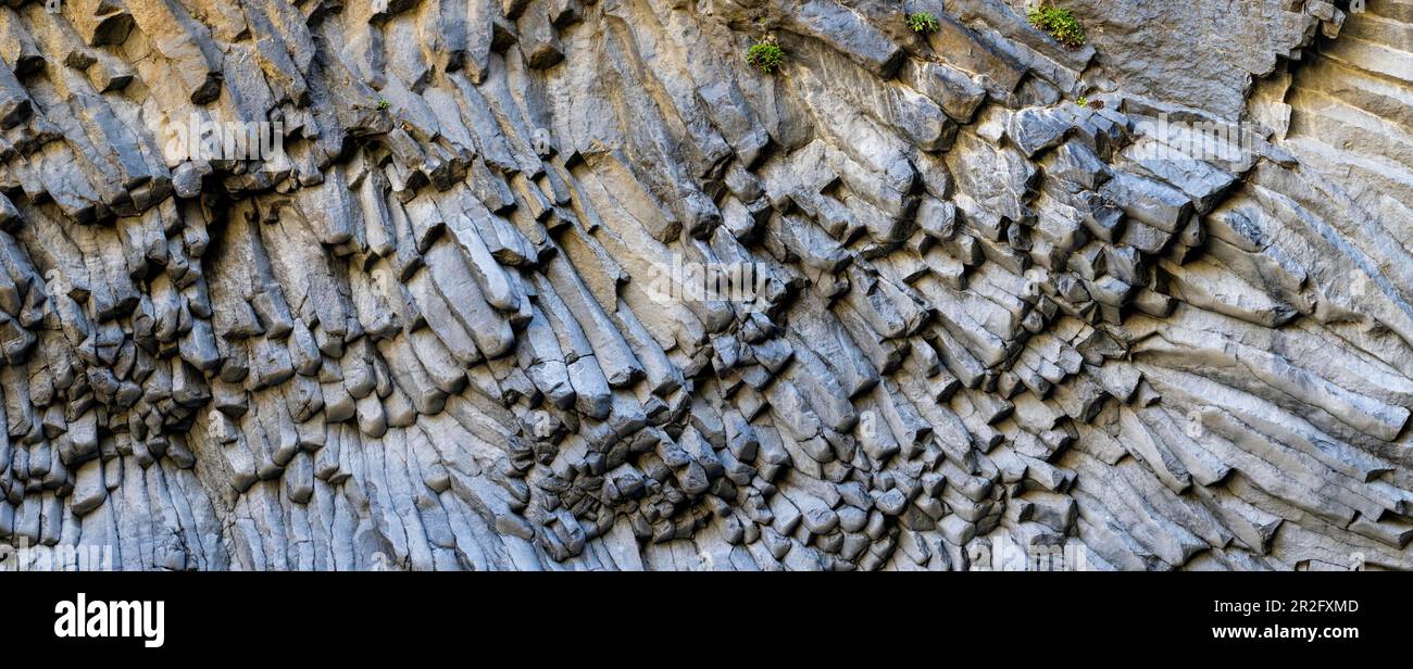 Rock formations of basalt and lava rock in the river park Gole dell ...