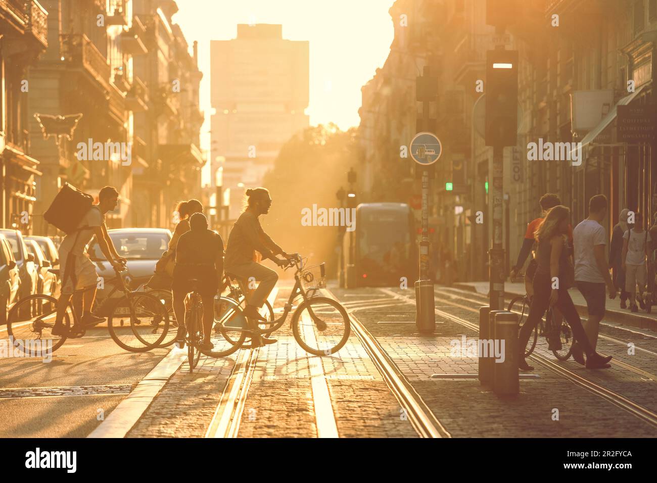 Street photography, people crossing the road during the sunset in ...