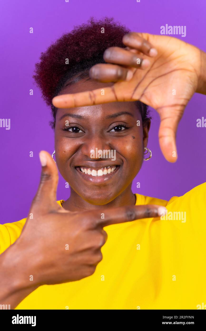 Young african american woman isolated on a purple background with ...