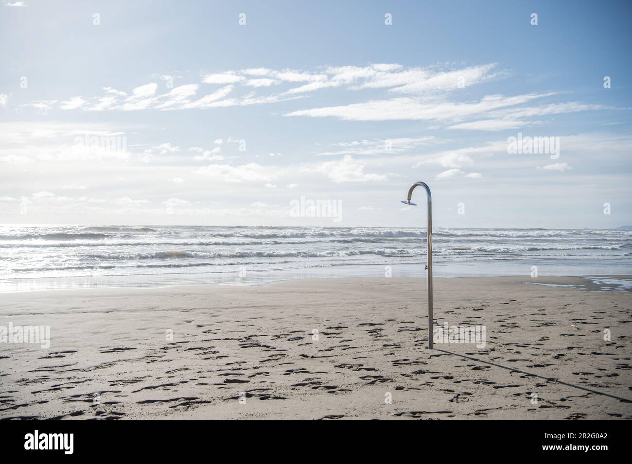 Shower in a deserted beach in winter, Forte die Marmi, Tuscany, Italy ...