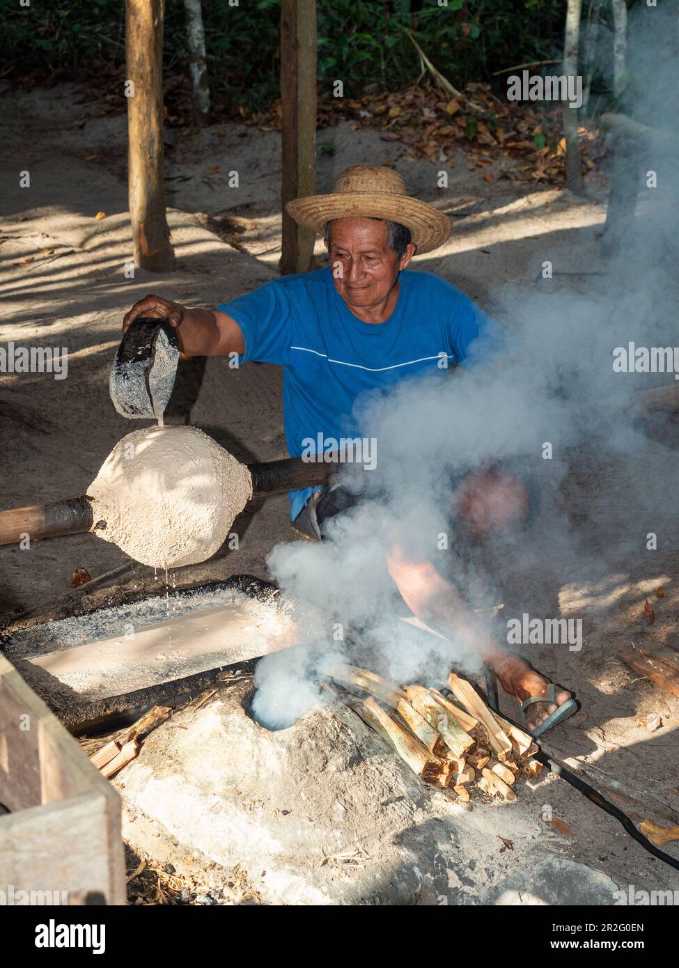 Man processes raw rubber, indigenous people on the Amazon near Manaus ...