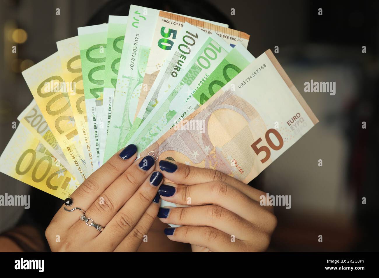 Euros money woman holding hi-res stock photography and images - Alamy