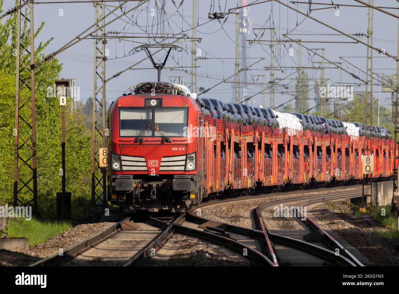 Goods train, loaded with new Mercedes cars, locomotive Siemens Vectron ...