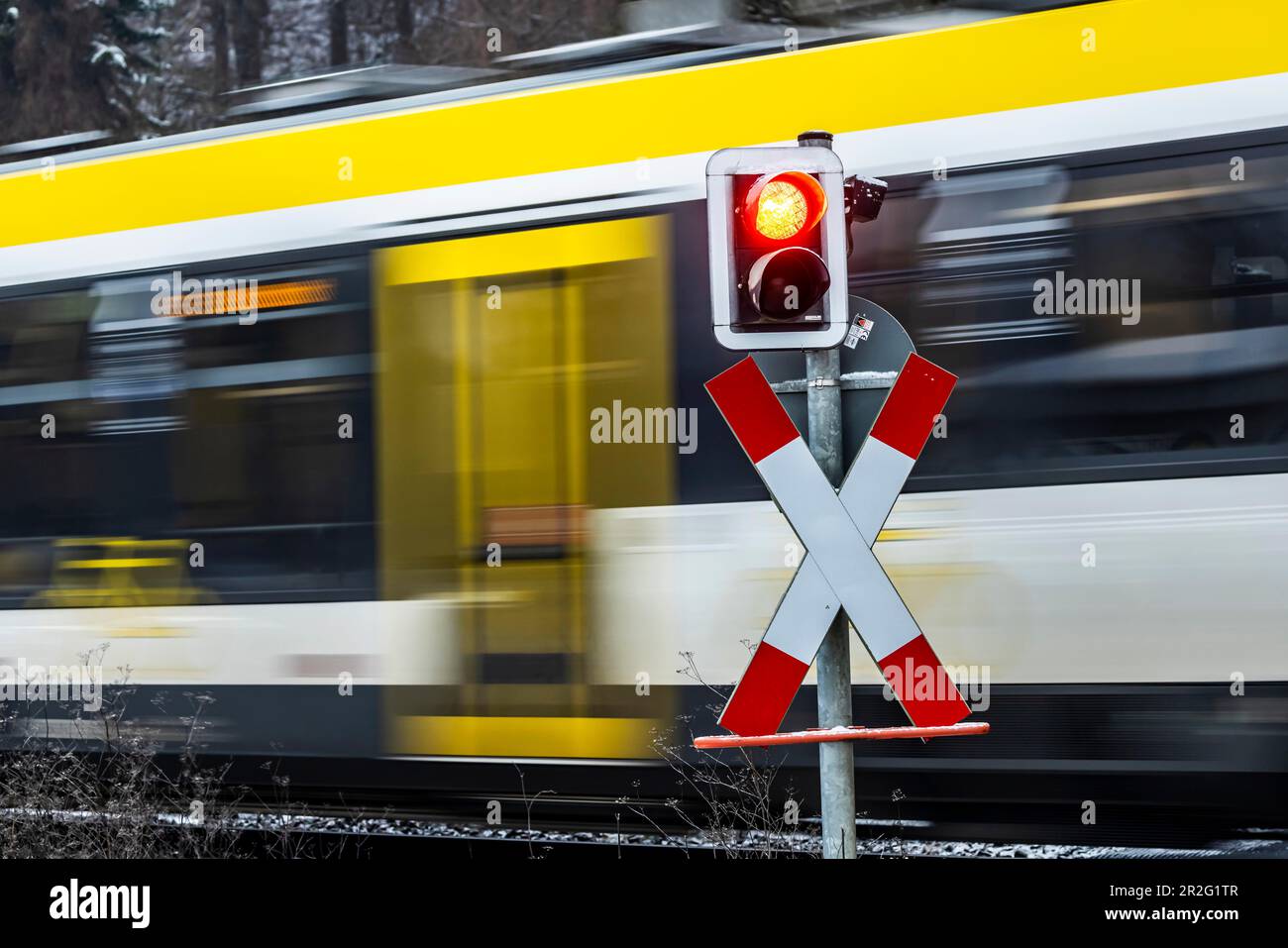 Level crossing with regional train, flashing warning light, Blaustein ...