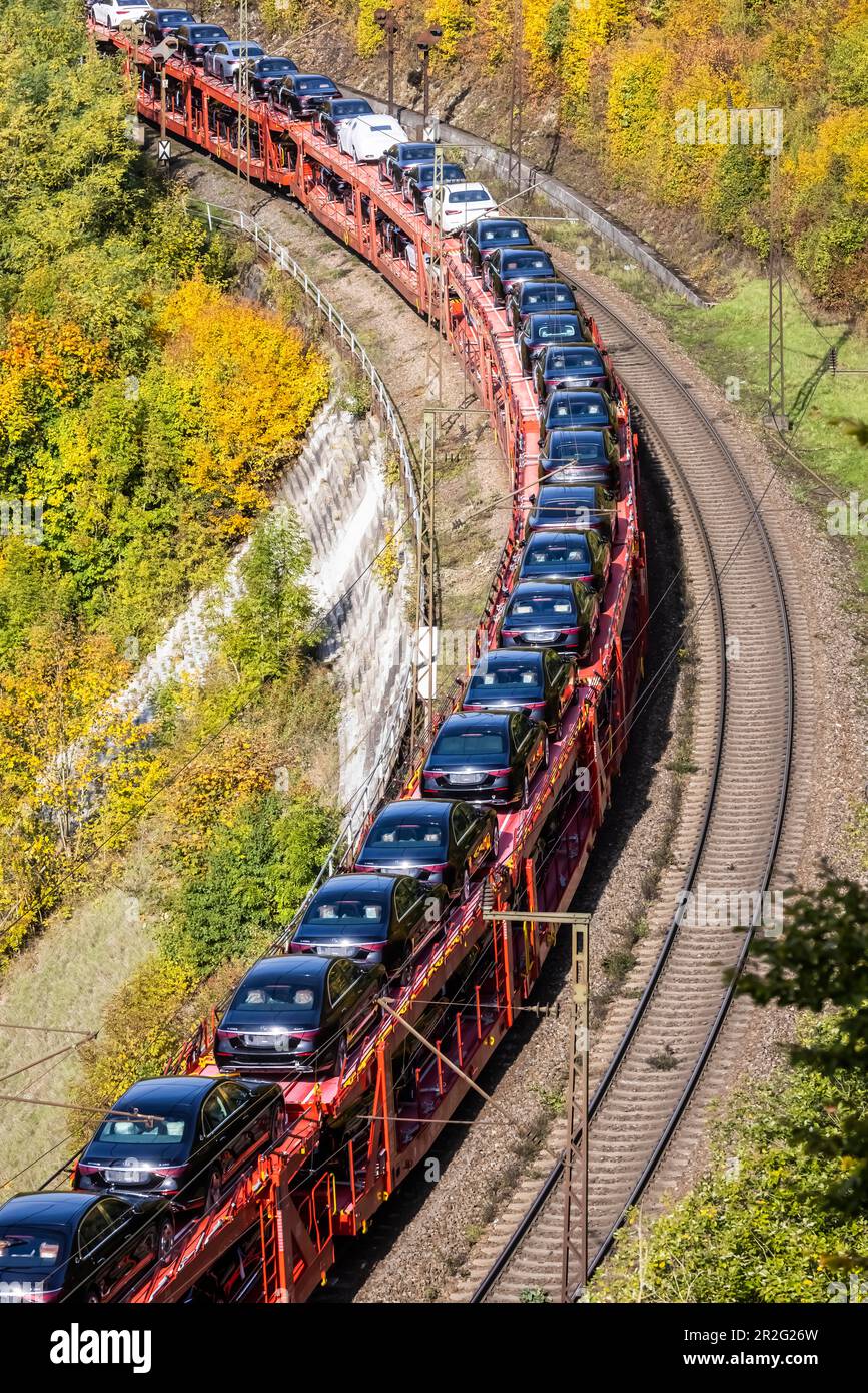Goods train with new Mercedes cars on the Geislinger Steige, winding ...