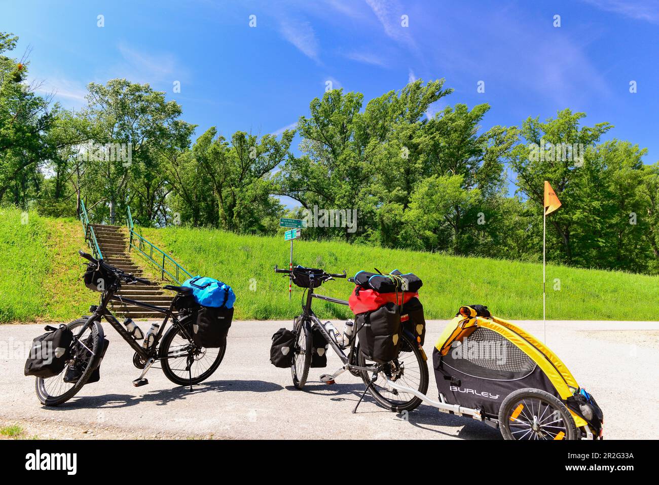 Fully packed travel bicycles with dog trailers on the Danube Cycle Path ...