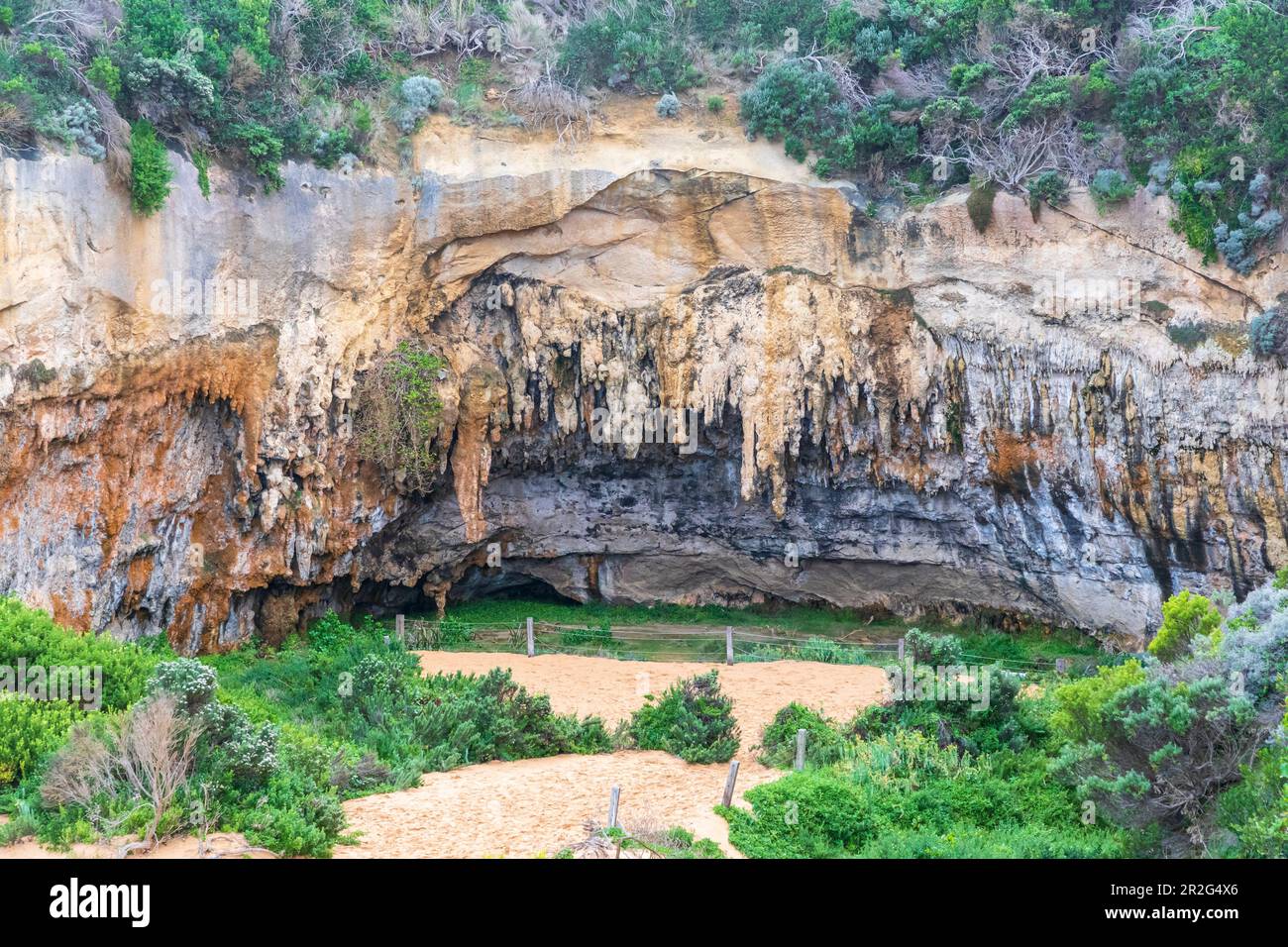 Photograph of water and wind erosion on a cliff face at Loch Ard Gorge ...
